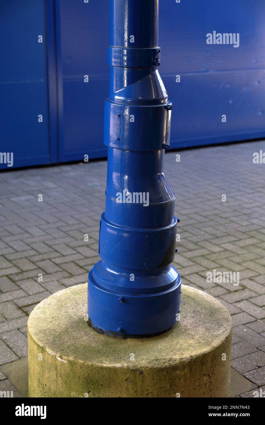 A large bore pipe channelling waste water down into a surface drain ...
