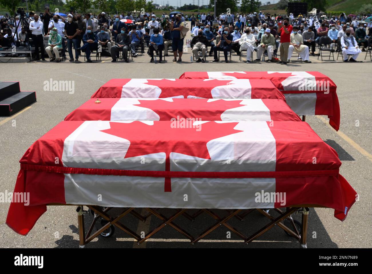 Caskets draped in Canadian flags are on display at a funeral for the ...