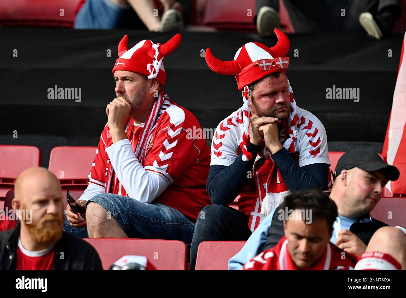 Denmark fans react after the game was suspended after Denmark's ...