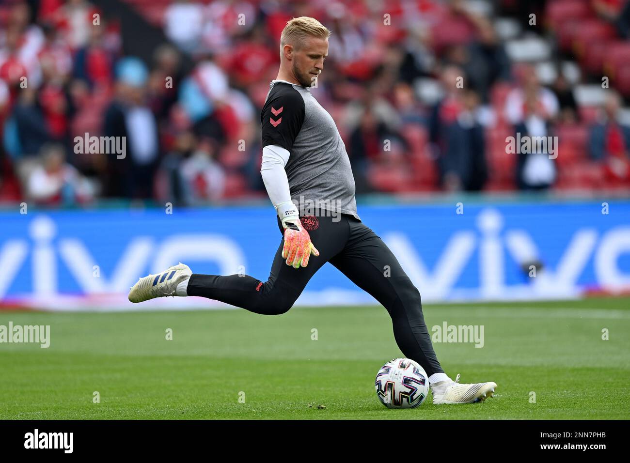 Denmark's goalkeeper Kasper Schmeichel kicks a ball during warmup ...