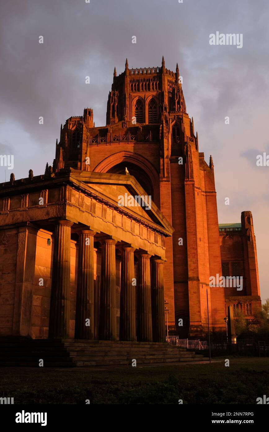 Liverpool Anglican Cathedral at sunset with golden light and a dark ...