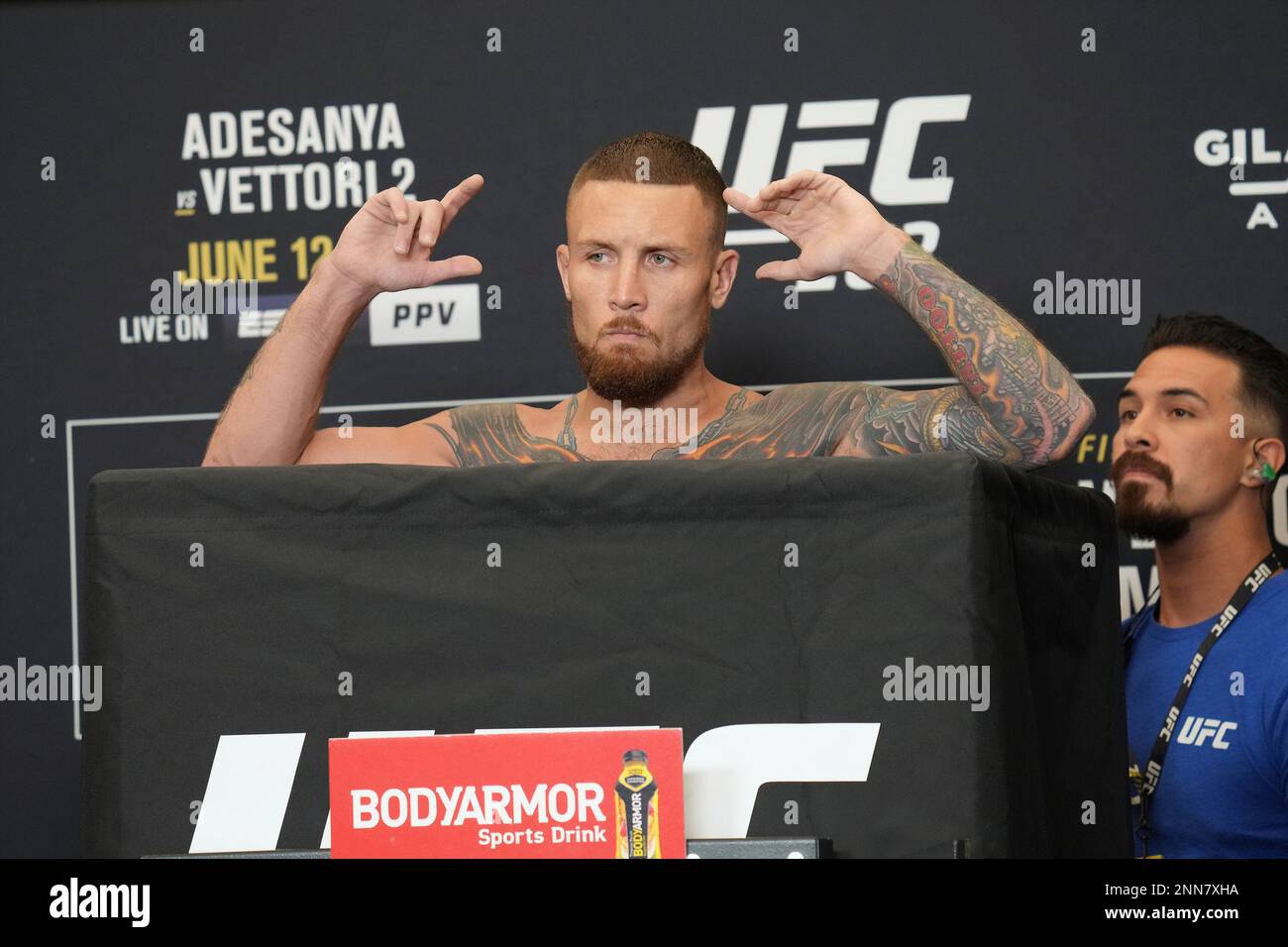 PHOENIX, AZ - JUNE 11: Steven Peterson steps on the scale for the ...