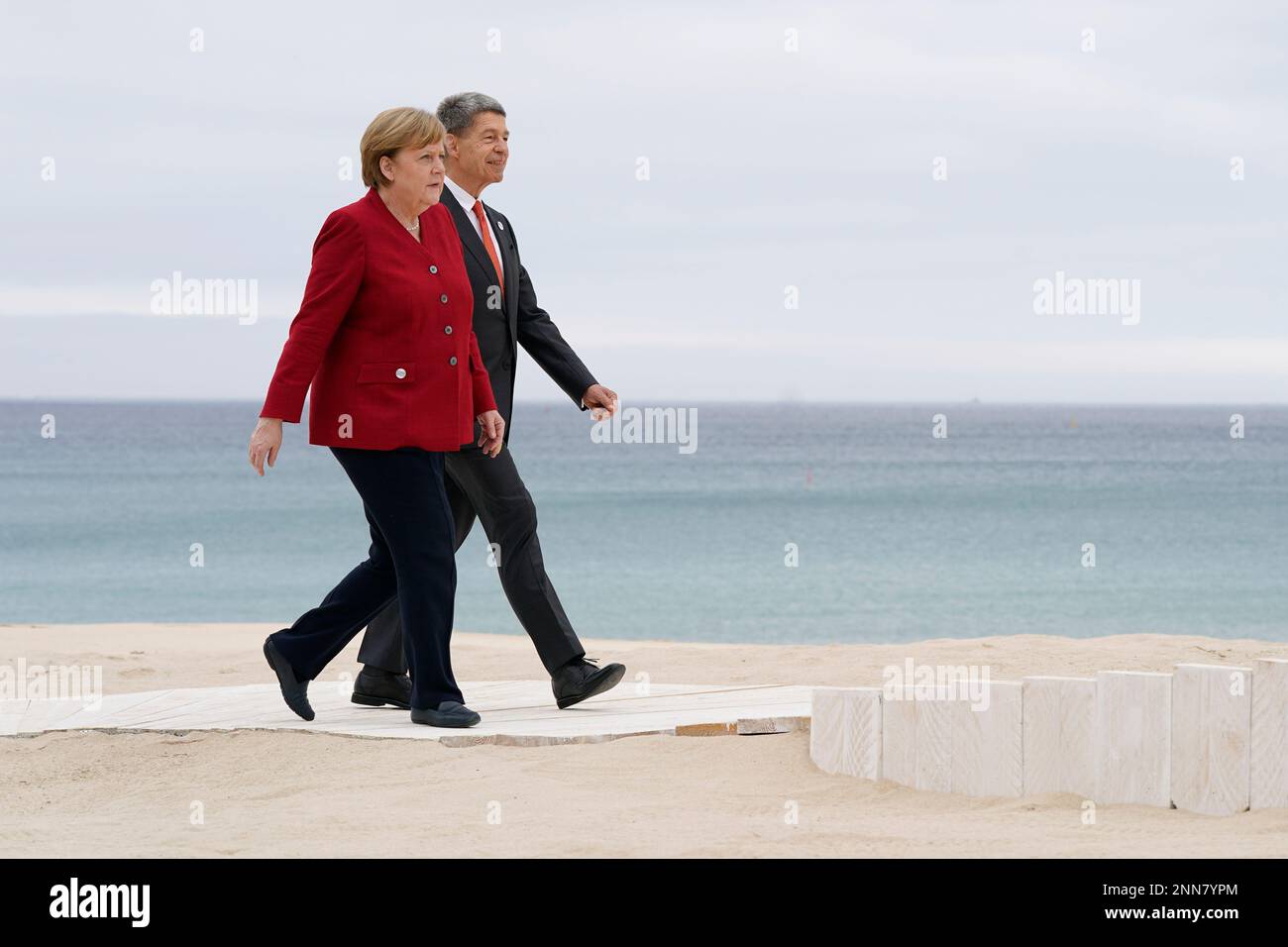 German Chancellor Angela Merkel and her husband Joachim Sauer arrive to ...