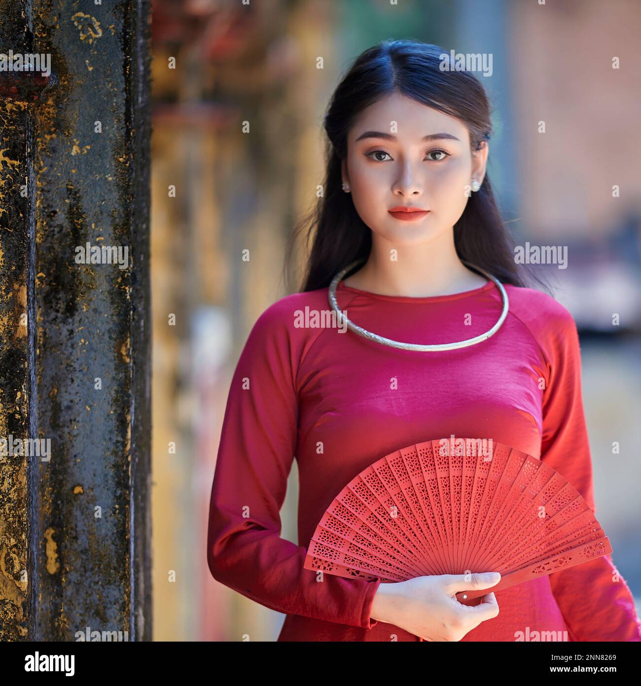Ho Chi Minh city, Viet Nam: Vietnamese girl going to pagoda in ao dai ...