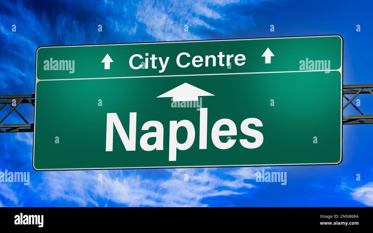Road sign indicating direction to the city of Naples Stock Photo - Alamy