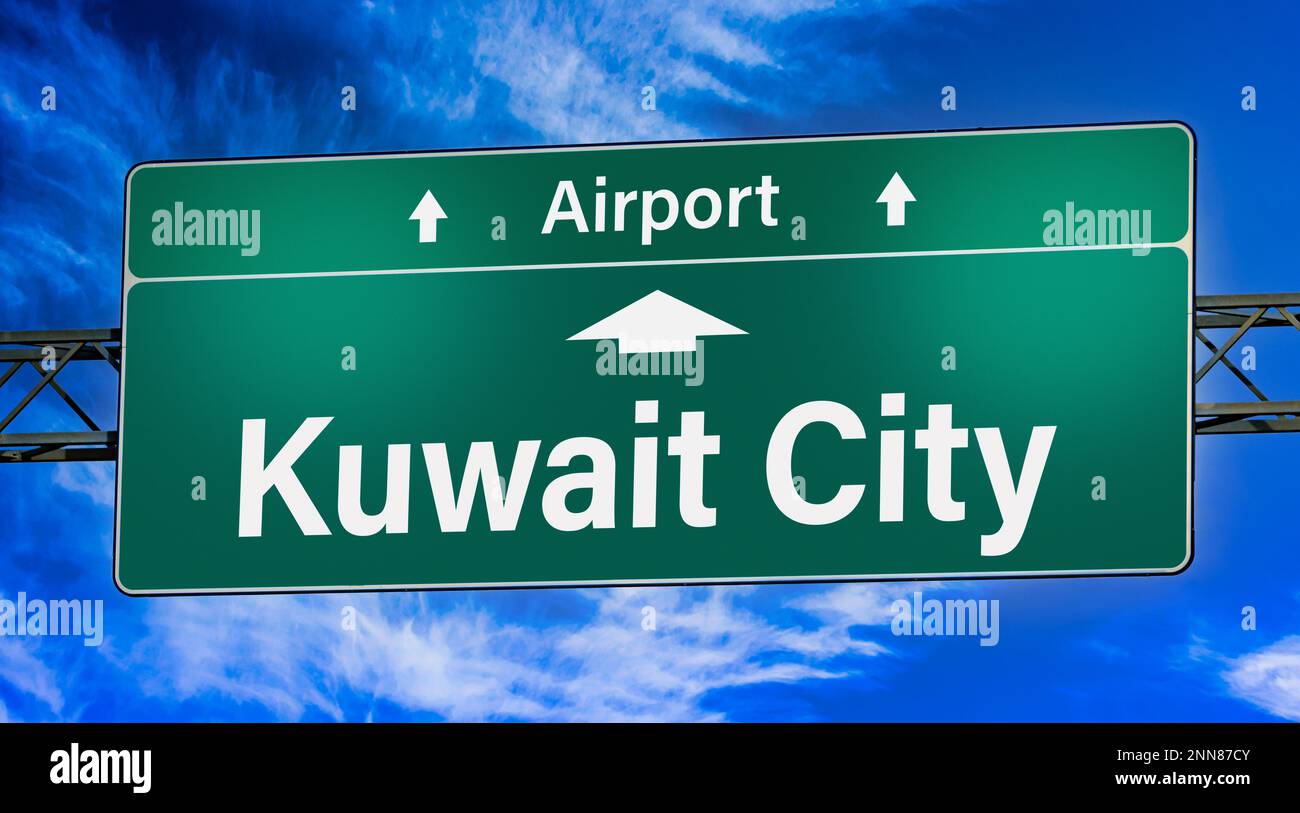 Road sign indicating direction to the city of Kuwait City Stock Photo ...