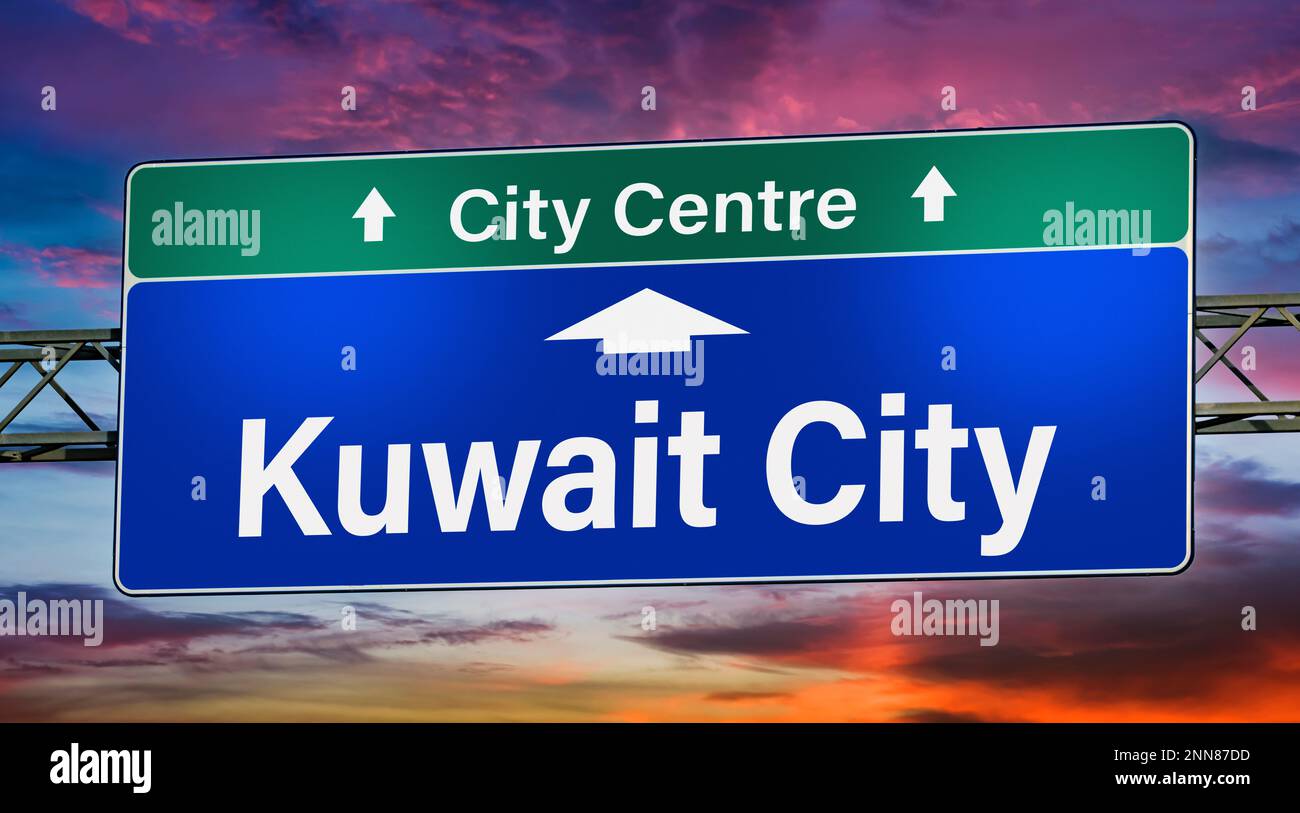 Road sign indicating direction to the city of Kuwait City Stock Photo ...
