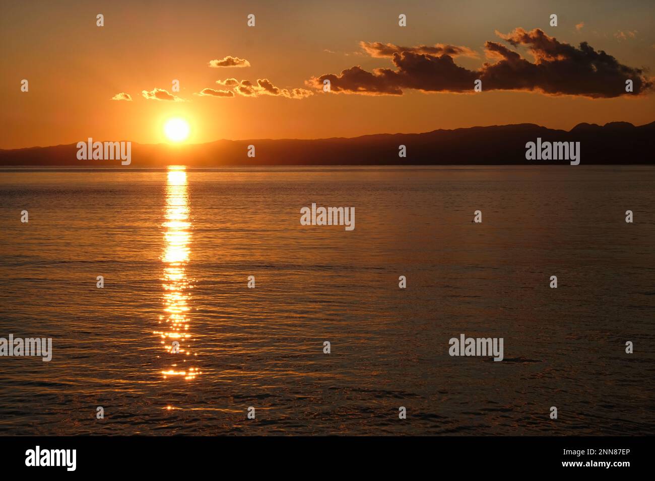 The setting sun coloring the sky over Enoshima, Japan Stock Photo - Alamy