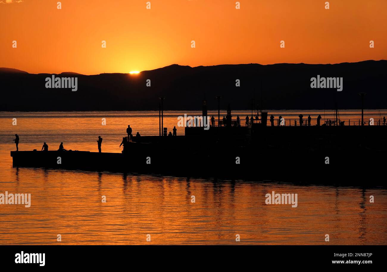 The setting sun coloring the sky over Enoshima, Japan Stock Photo - Alamy