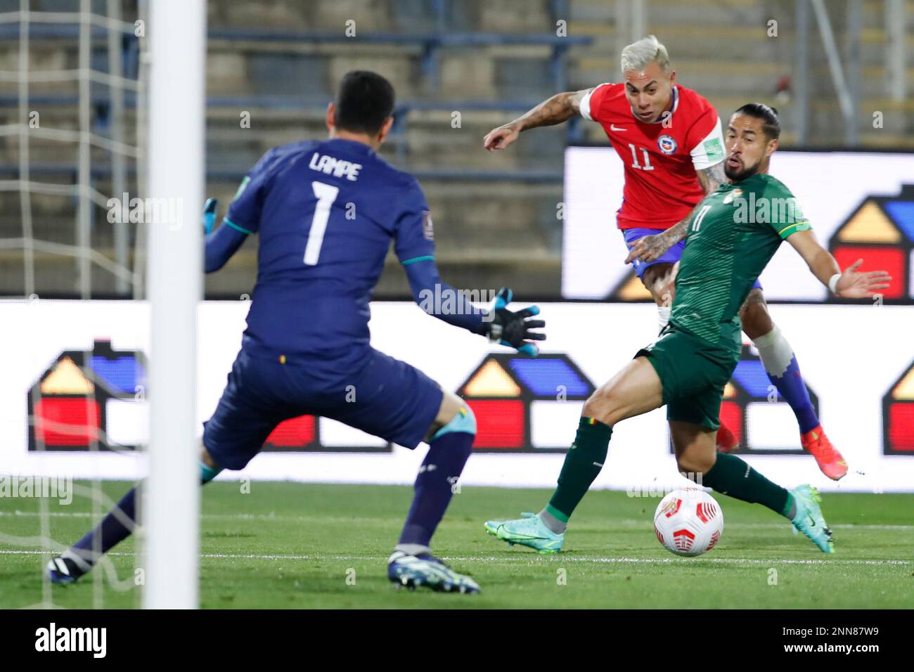 Bolivia's Rodrigo Ramallo, right, and Chile's Eduardo Vargas, center ...
