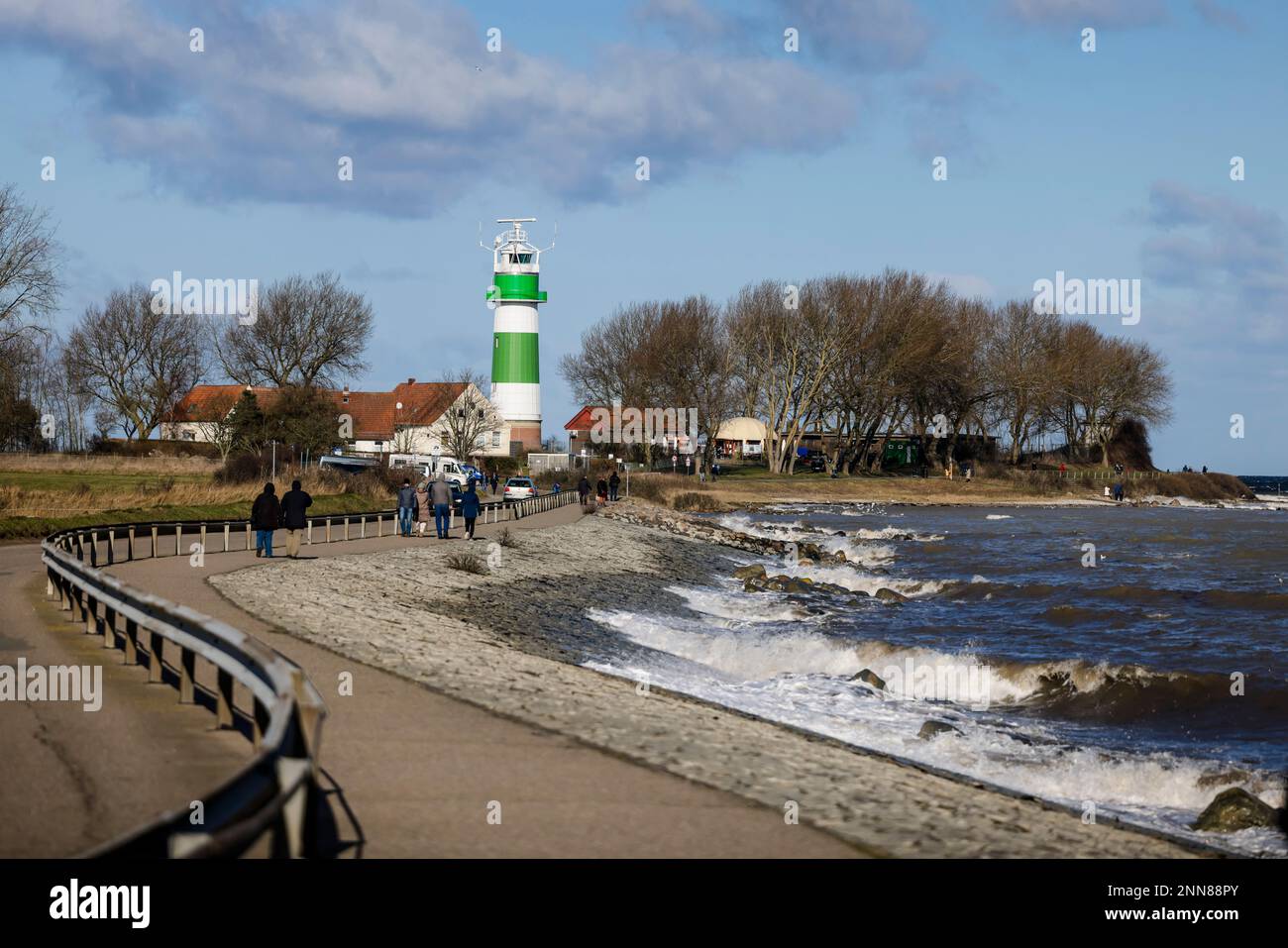 Strande, Germany. 25th Feb, 2023. People walking on the Baltic Sea ...