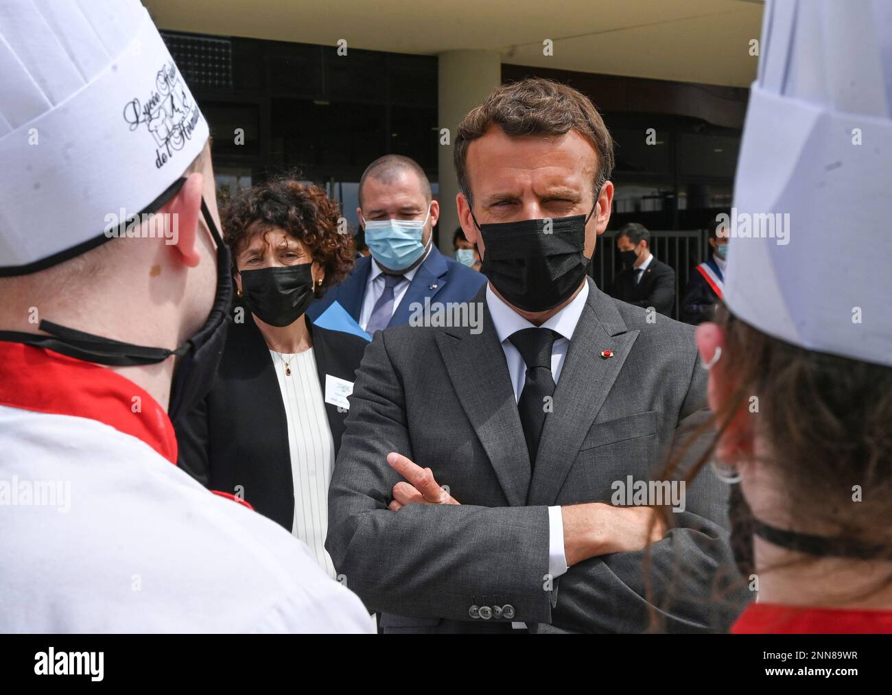 French President Emmanuel Macron talks with cooking students, Tuesday ...