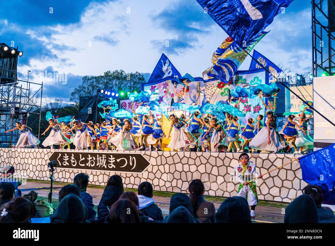 Over shoulder audience view of Japanese female Yosakoi dancers dancing ...