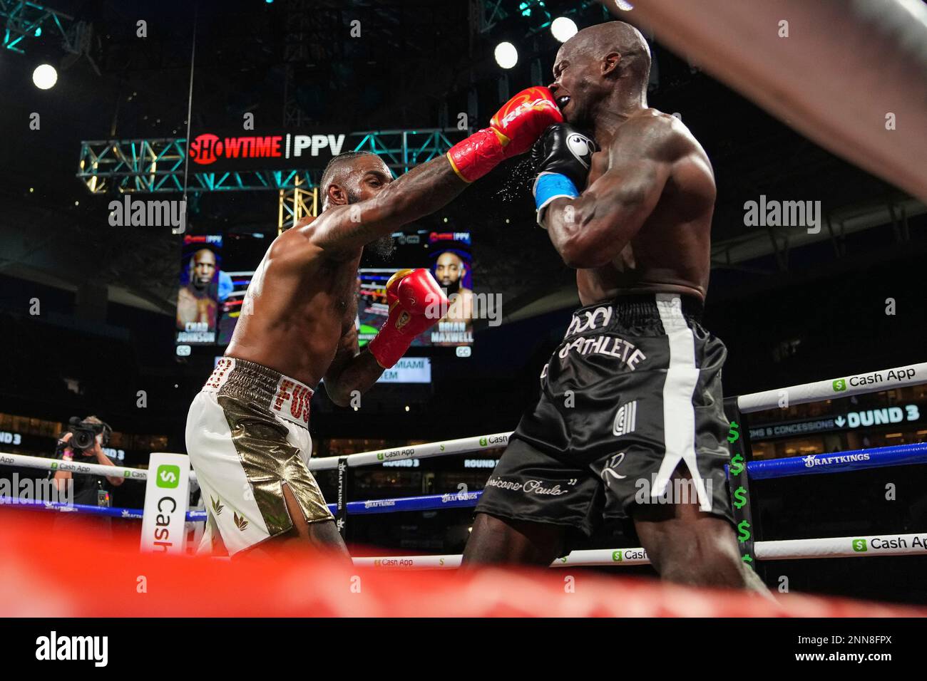 Former NFL wide receiver Chad "Ochocinco" Johnson (right) is struck in ...