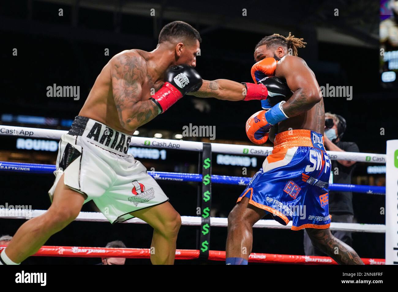 Boxer Luis Arias (right) strikes Jarrett Hurd (right) during a boxing ...