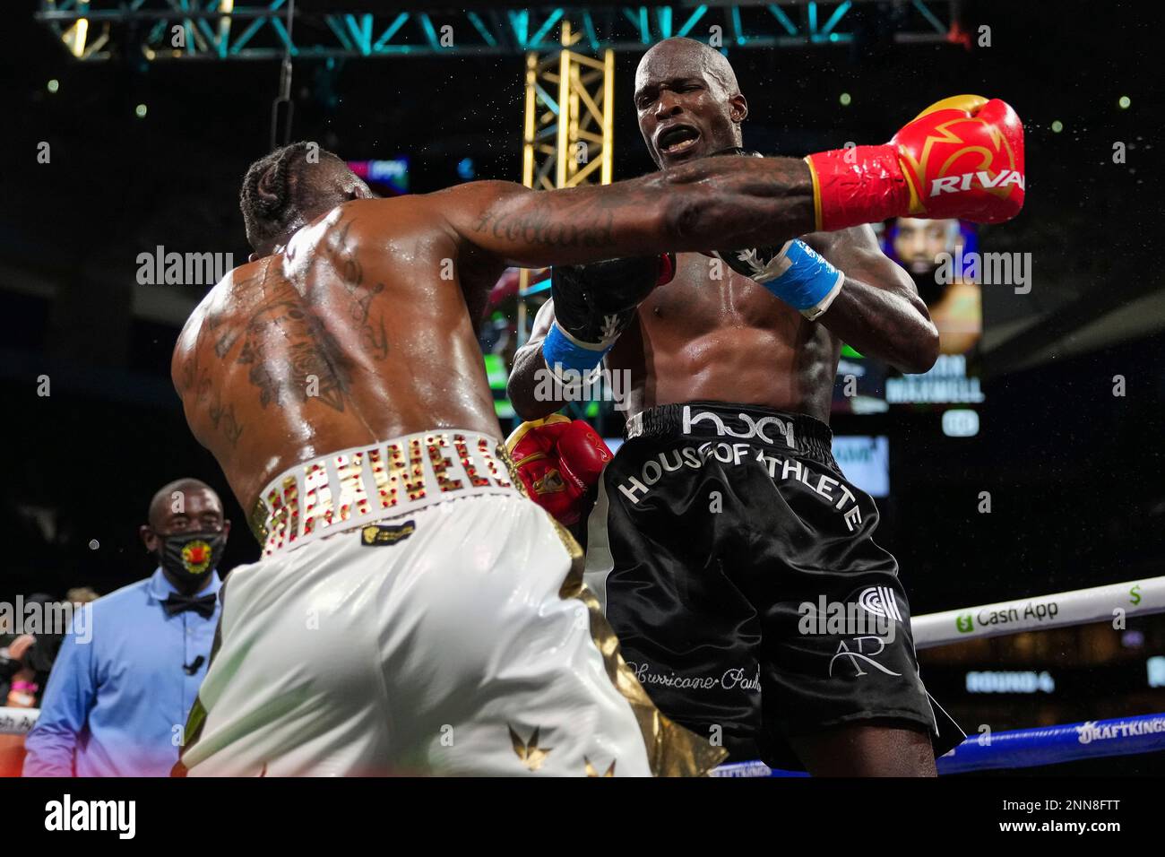 MMA fighter Brian Maxwell (left) fights against former NFL wide ...