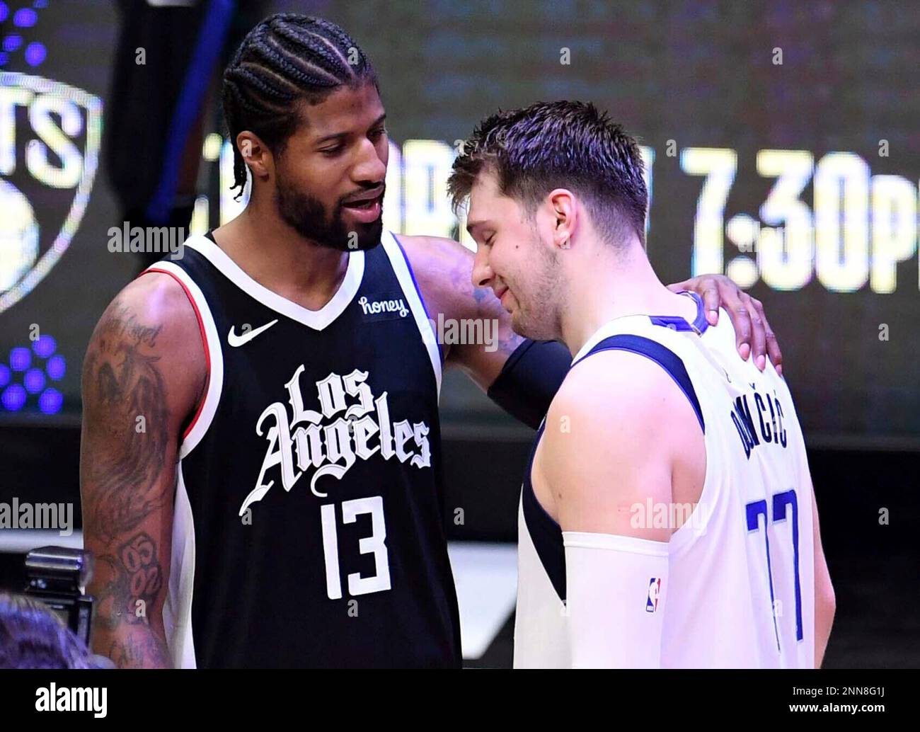 Los Angeles Clippers' Paul George (13) consoles Dallas Mavericks' Luka ...