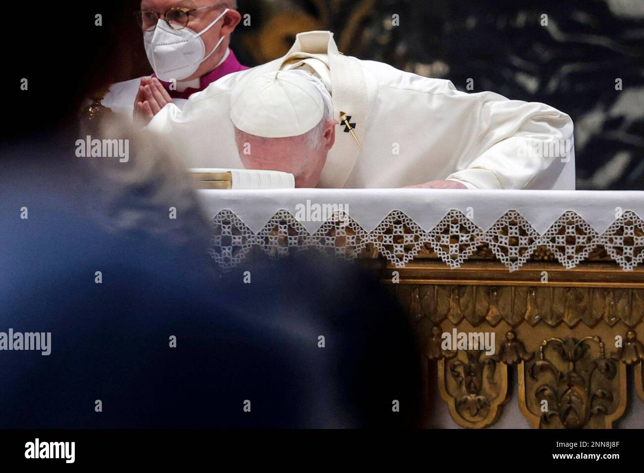 Pope Francis kisses the altar as he celebrates Mass on the Solemnity of ...