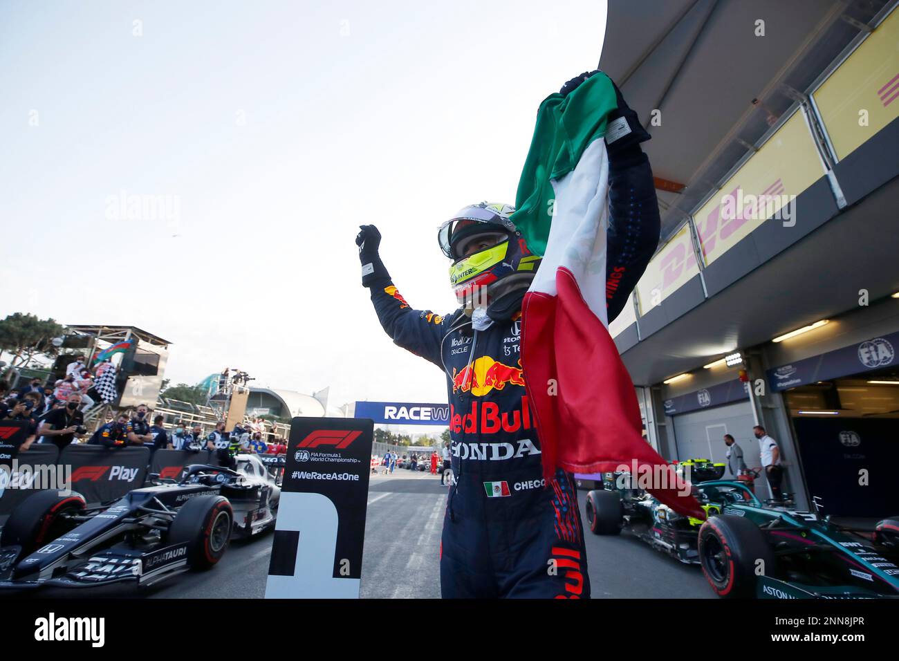 Red Bull driver Sergio Perez of Mexico jubilates after winning the ...