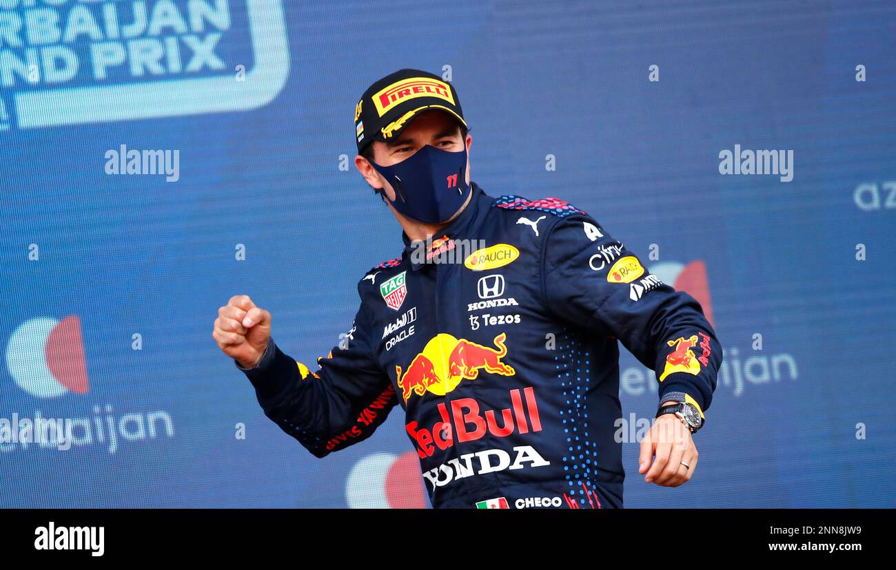 Red Bull driver Sergio Perez of Mexico celebrates on the podium after ...