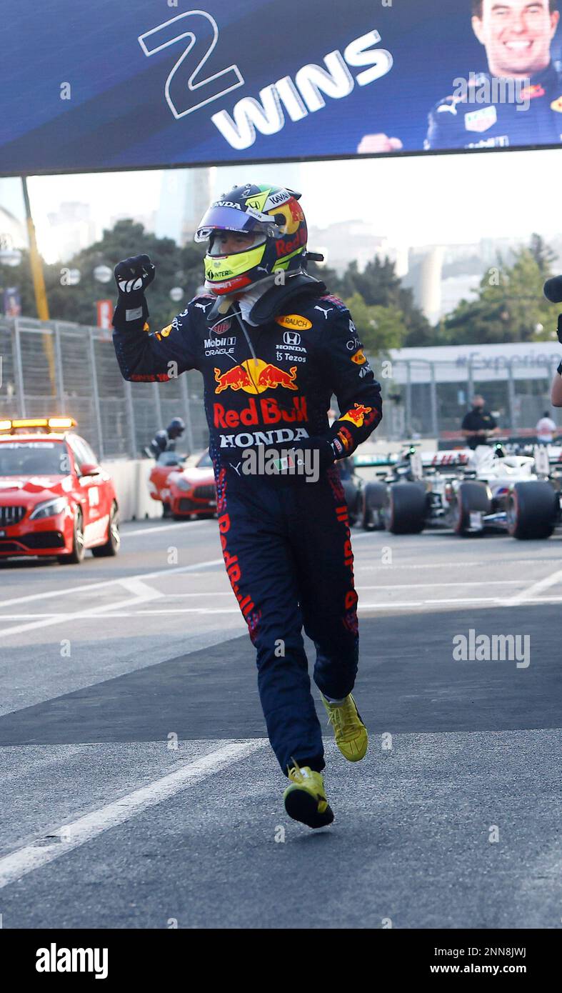 Red Bull driver Sergio Perez of Mexico jubilates after winning the ...