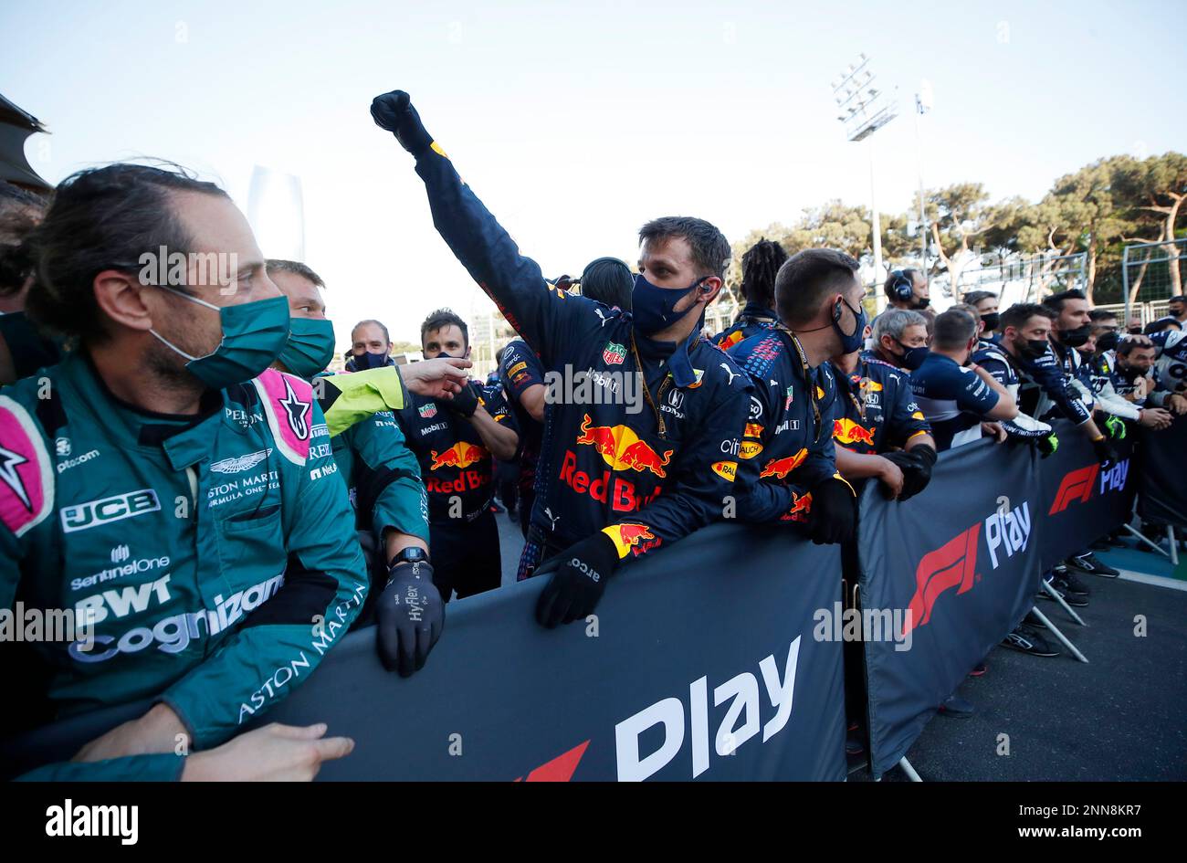 A member of the Red Bull crew cheers as Red Bull driver Sergio Perez of ...