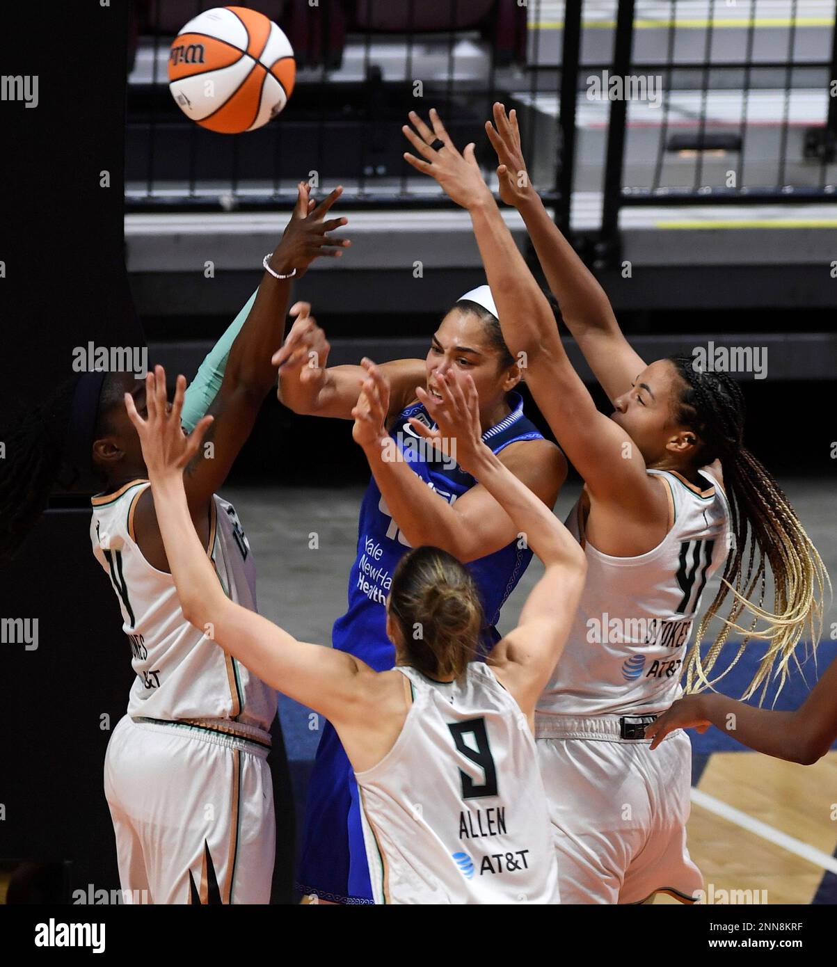 Connecticut Sun forward Brionna Jones passes out of the triple-team ...