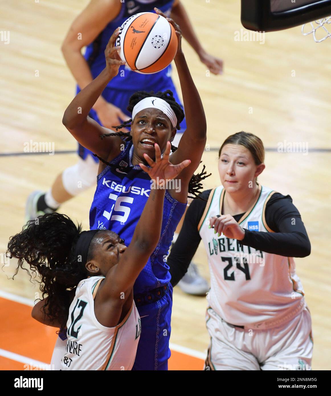 Connecticut Sun forward Jonquel Jones (35) works between New York ...