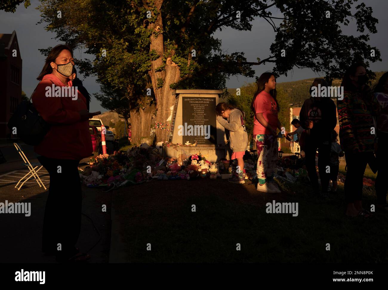 People gather around a makeshift memorial at a monument outside the ...