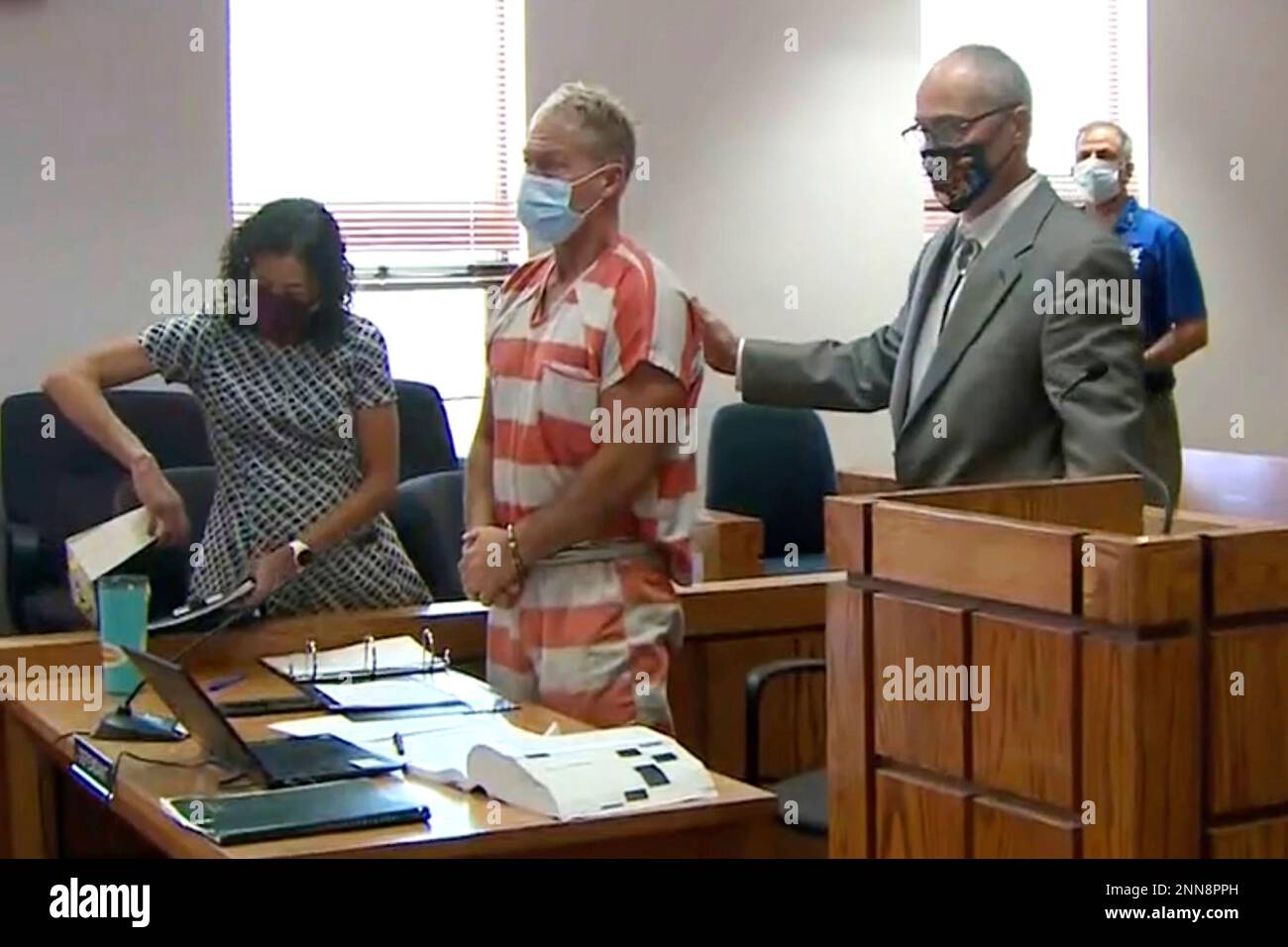 FILE - In this Thursday, May 6, 2021, file still image from video, Barry Morphew, center ...