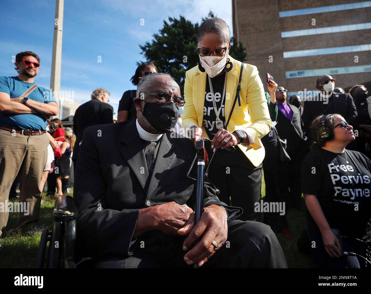 Rolanda Holman attends to her father, Pastor Carl Payne, during a vigil ...