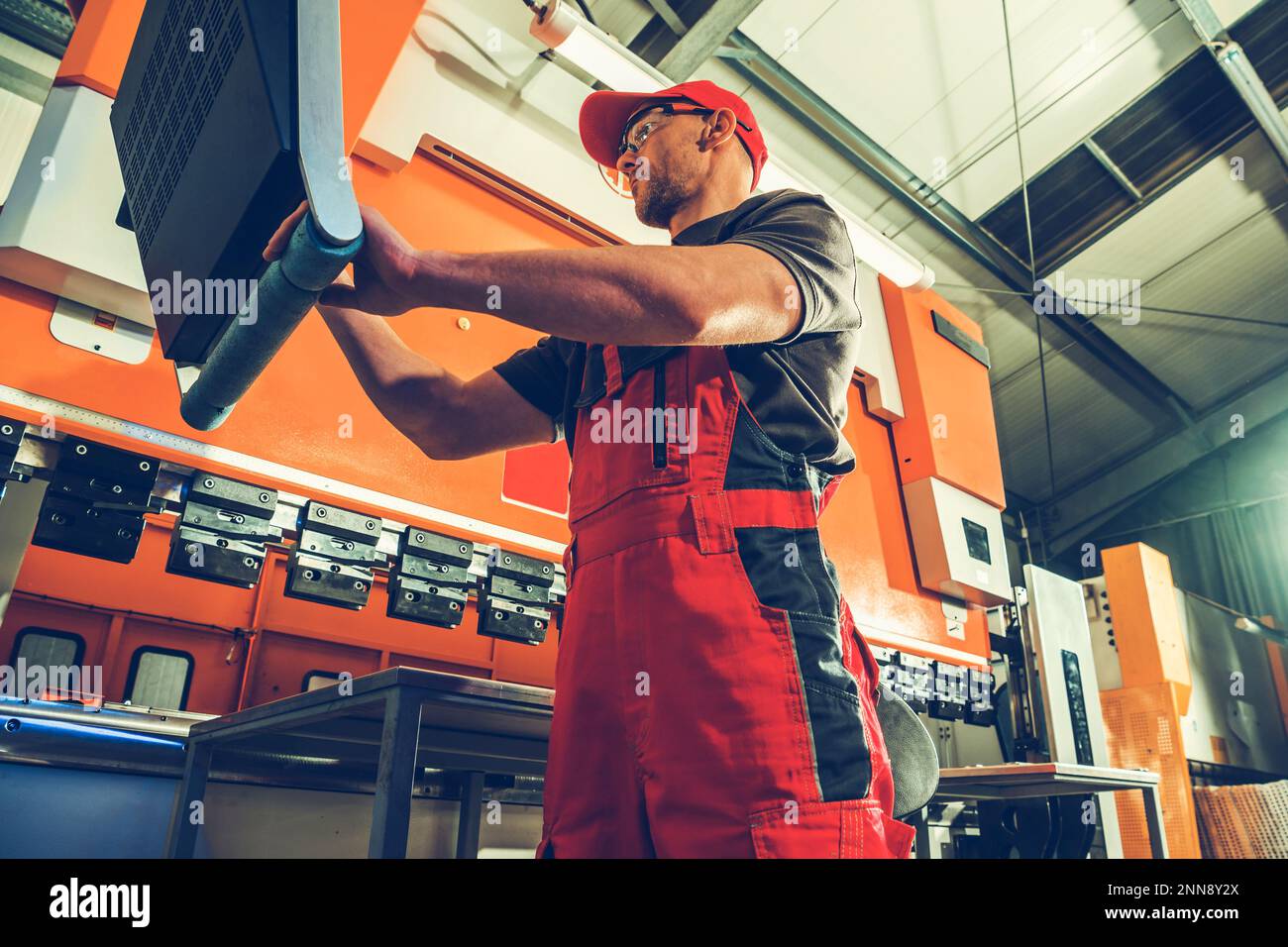 Professional Caucasian Bending Machine Machinist at Work in ...
