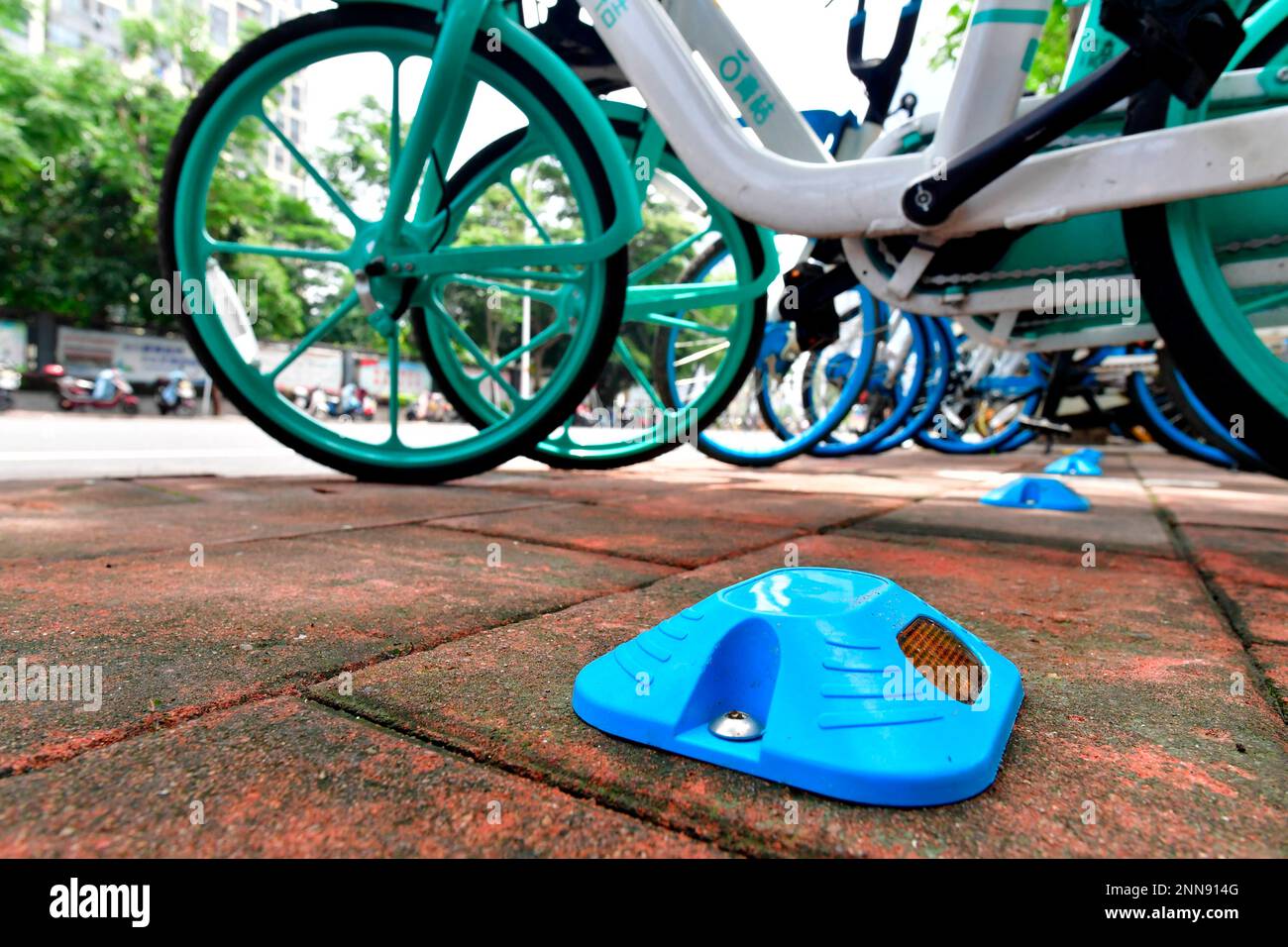 The bluetooth road spike is set up beside the bike-sharing station to ...