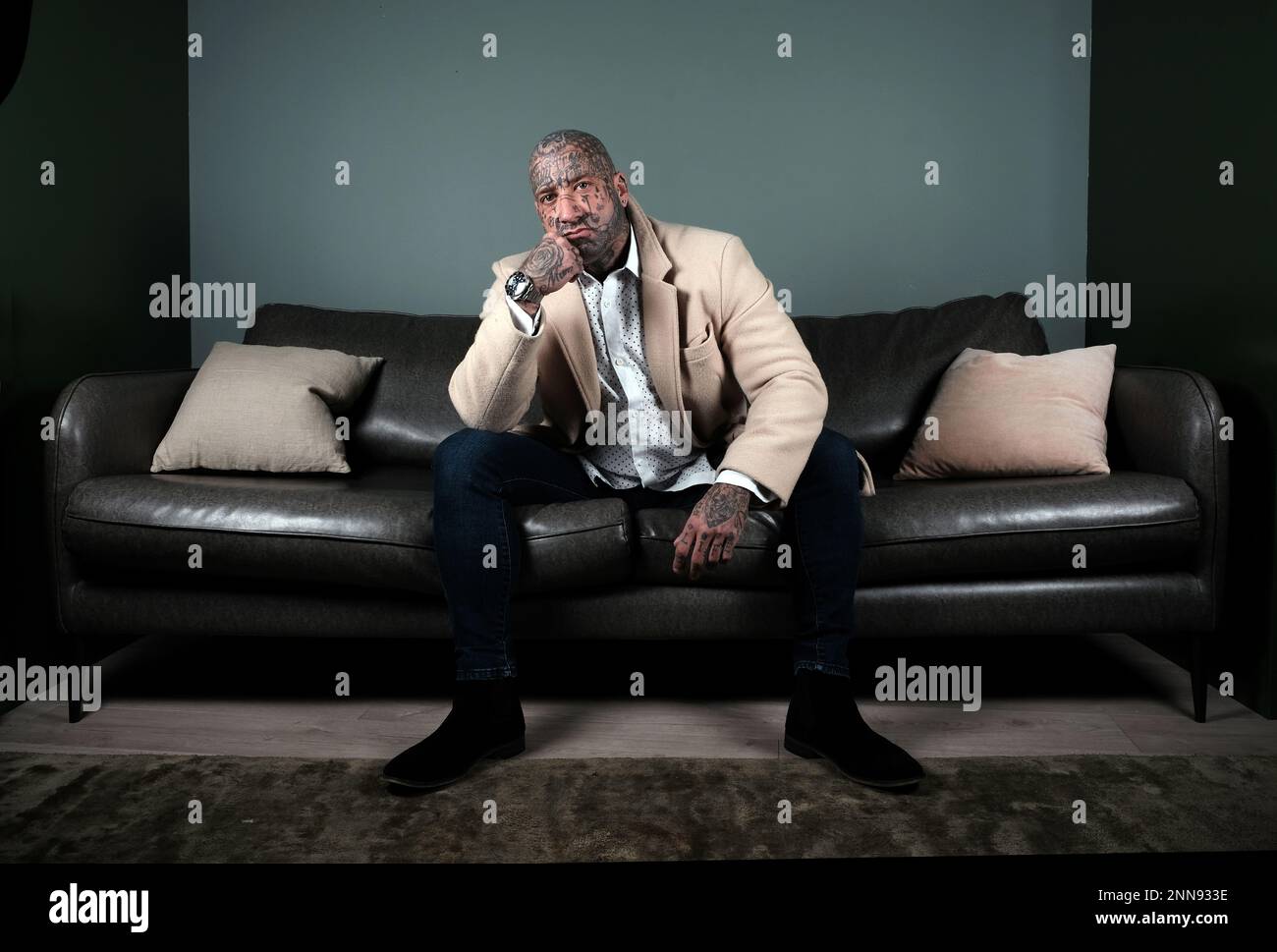 Ian Griggs (aka Mr. Ink) Sitting on Sofa Stock Photo - Alamy