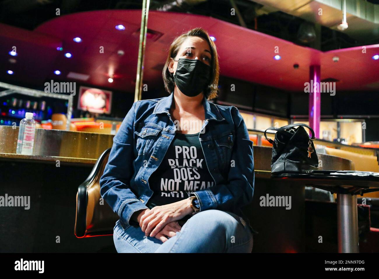 Flight attendant Jennifer Gentry waits after getting a shot during a ...