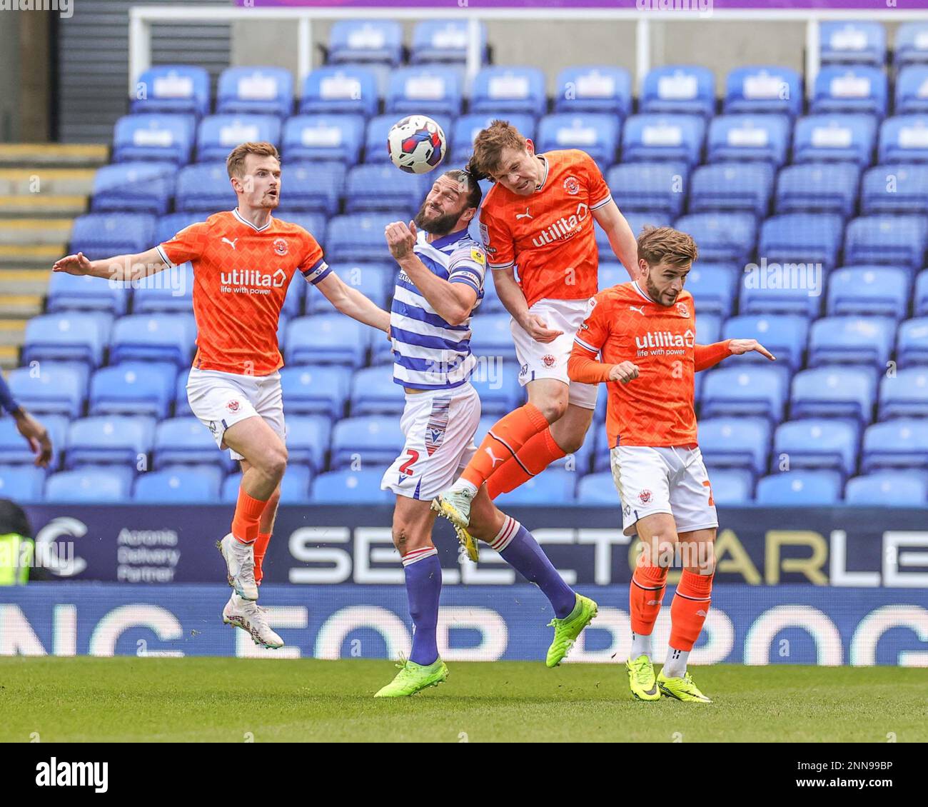 Jordan Thorniley #34 of Blackpool wins the header from Andy Carroll #2 ...