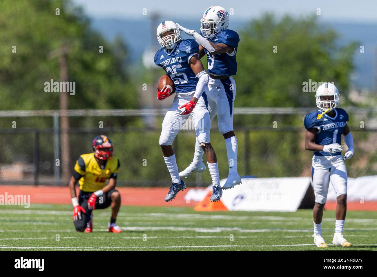 Pennsylvania's Stephon Hall celebrates an interception with Abdul ...