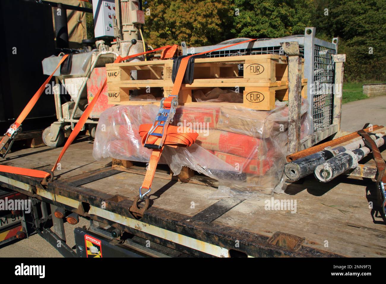 Cargo on a trailer was secured with a ratchet strap Stock Photo - Alamy