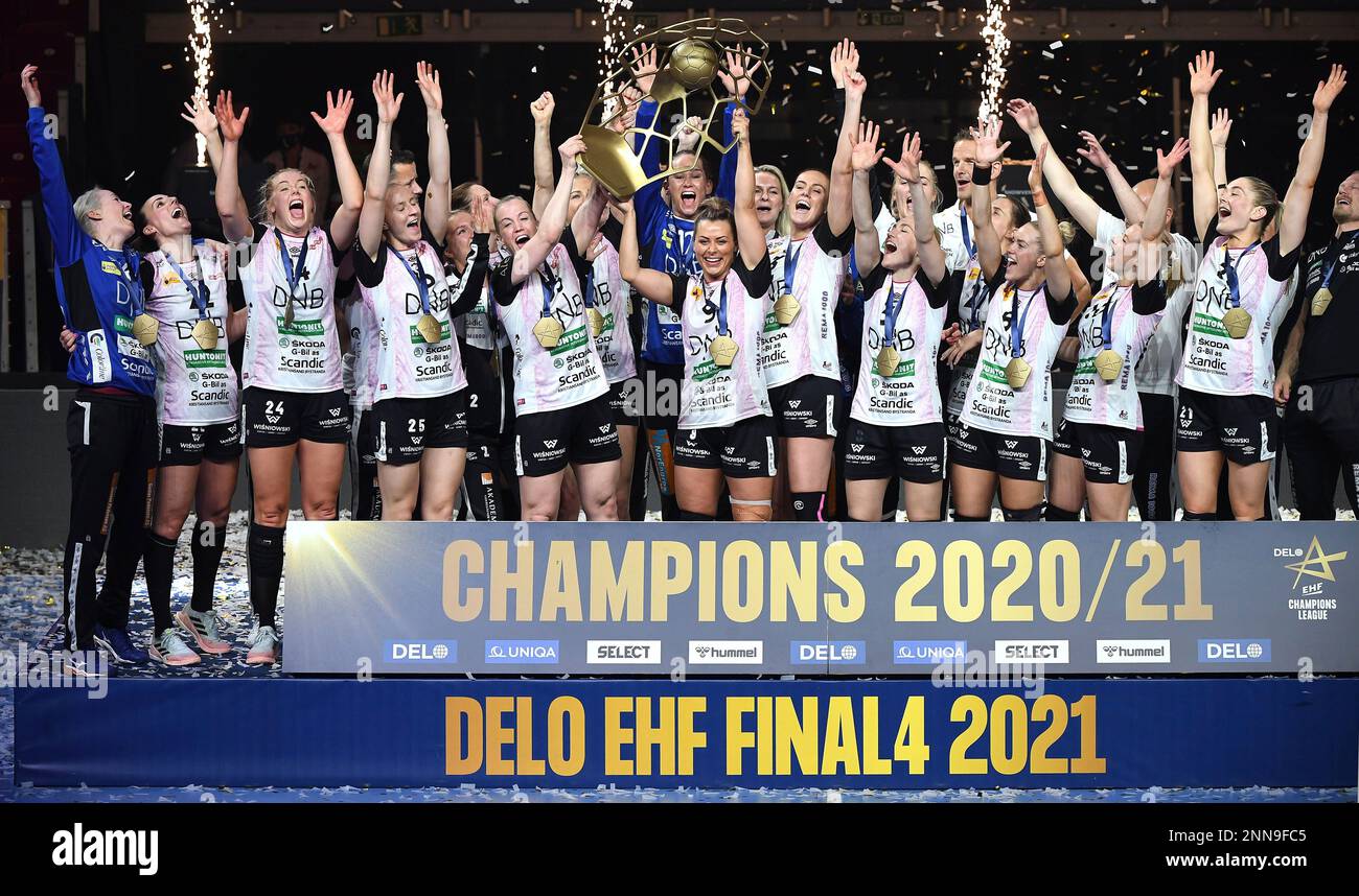 Players of Vipers Kristiansand celebrate with the trophy after they won women's handball ...