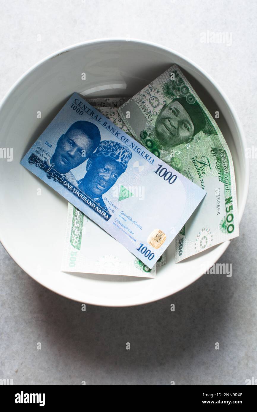 the new Nigerian 1000 and 500 Naira notes in a white bowl, Nigeria's ...