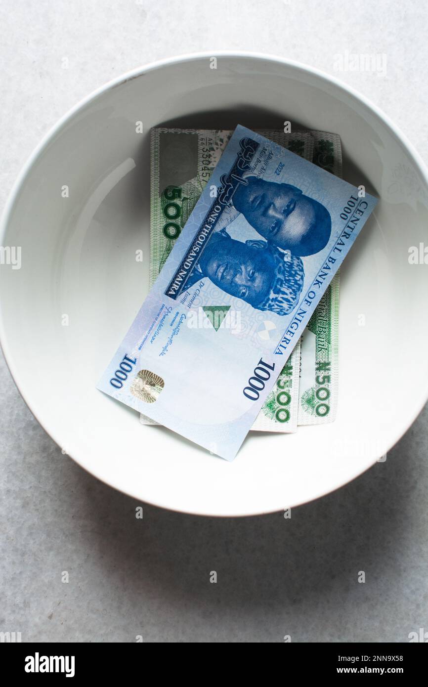 the new Nigerian 1000 and 500 Naira notes in a white bowl, Nigeria's ...