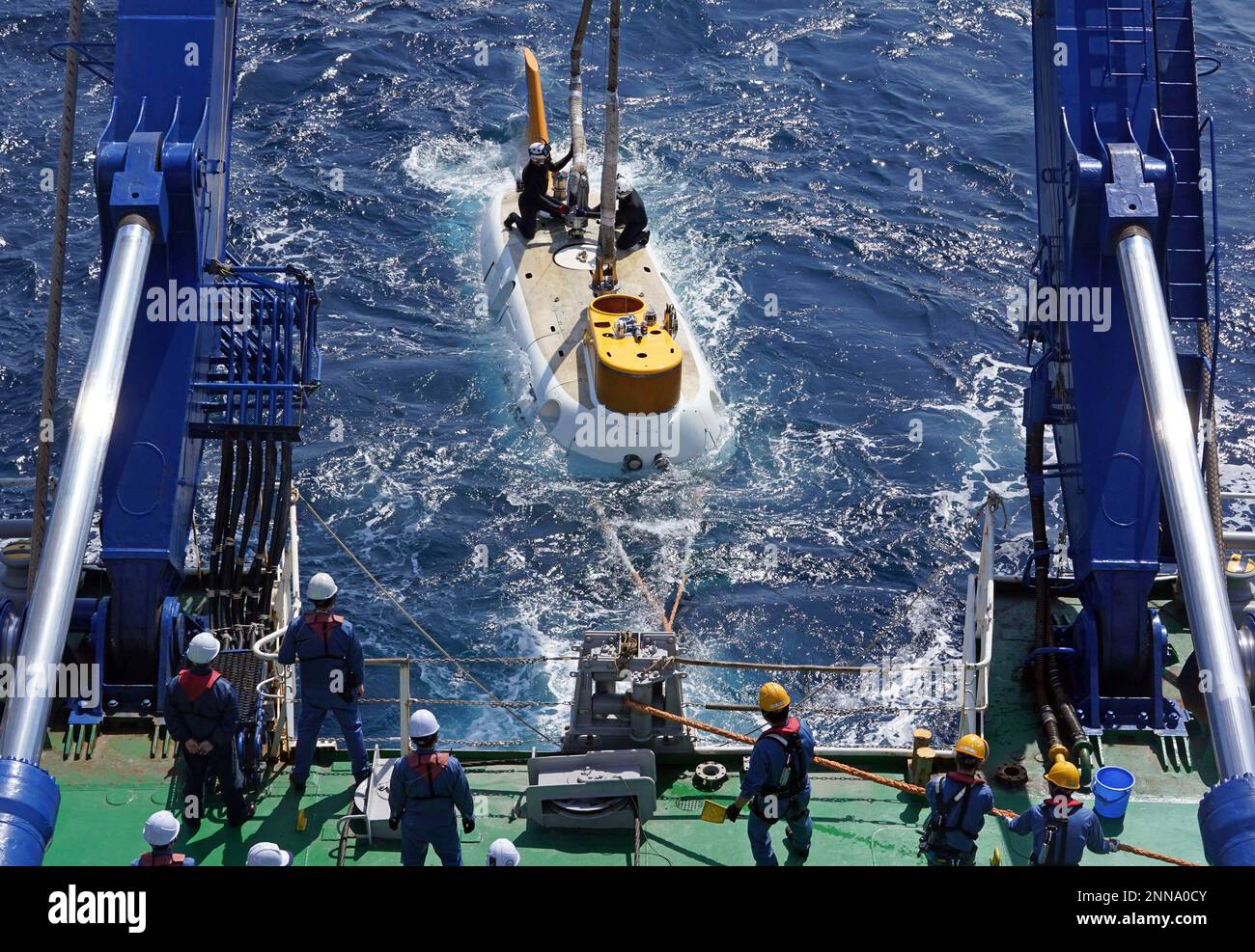 Shinkai 6500 is lifted from the mother ship off the coast of Suruga Bay ...