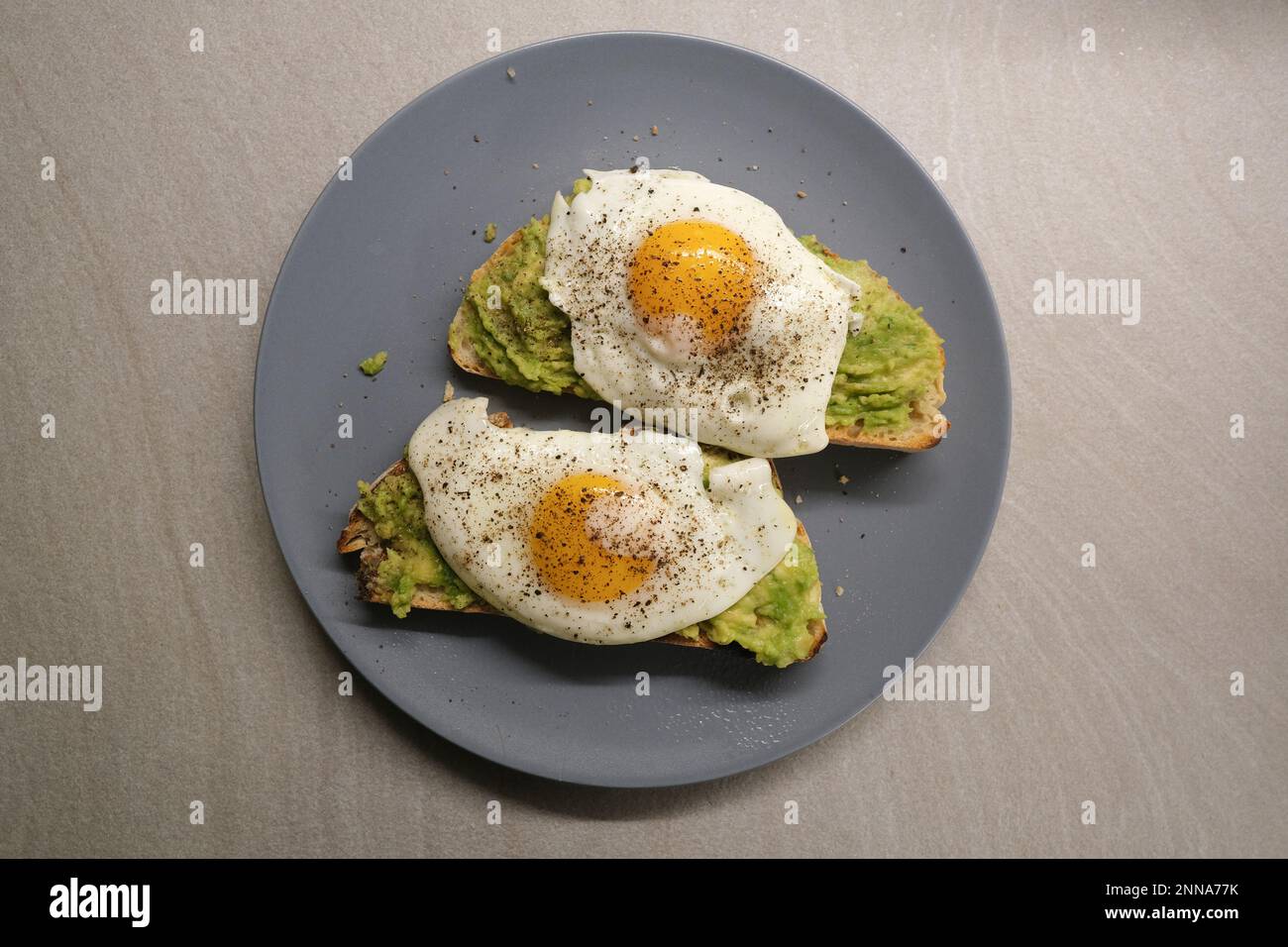 Avocado toast it's a snack for a mid morning break Stock Photo - Alamy