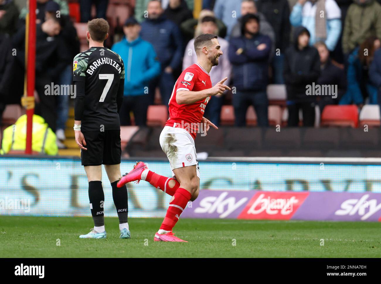 Barnsley's Adam Phillips (centre) celebrates scoring their side's ...