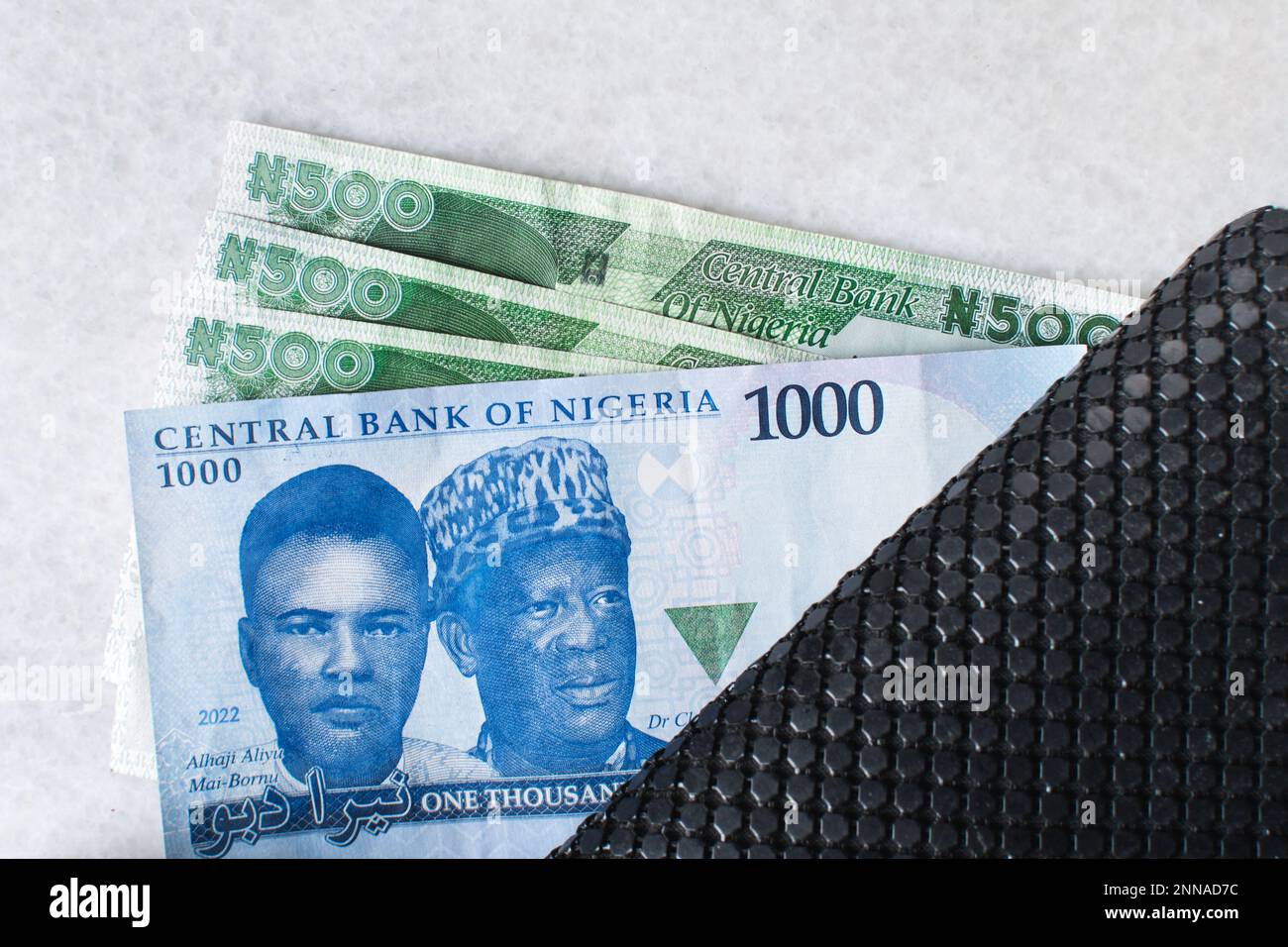 The new Nigerian 1000 Naira note in a black purse, Nigeria's new ...