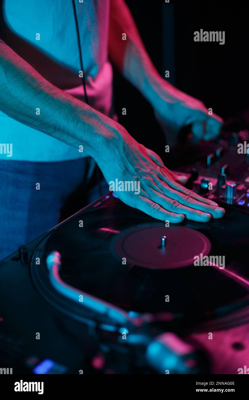 Hip hop dj scratching vinyl record on turntable player. Club disc ...