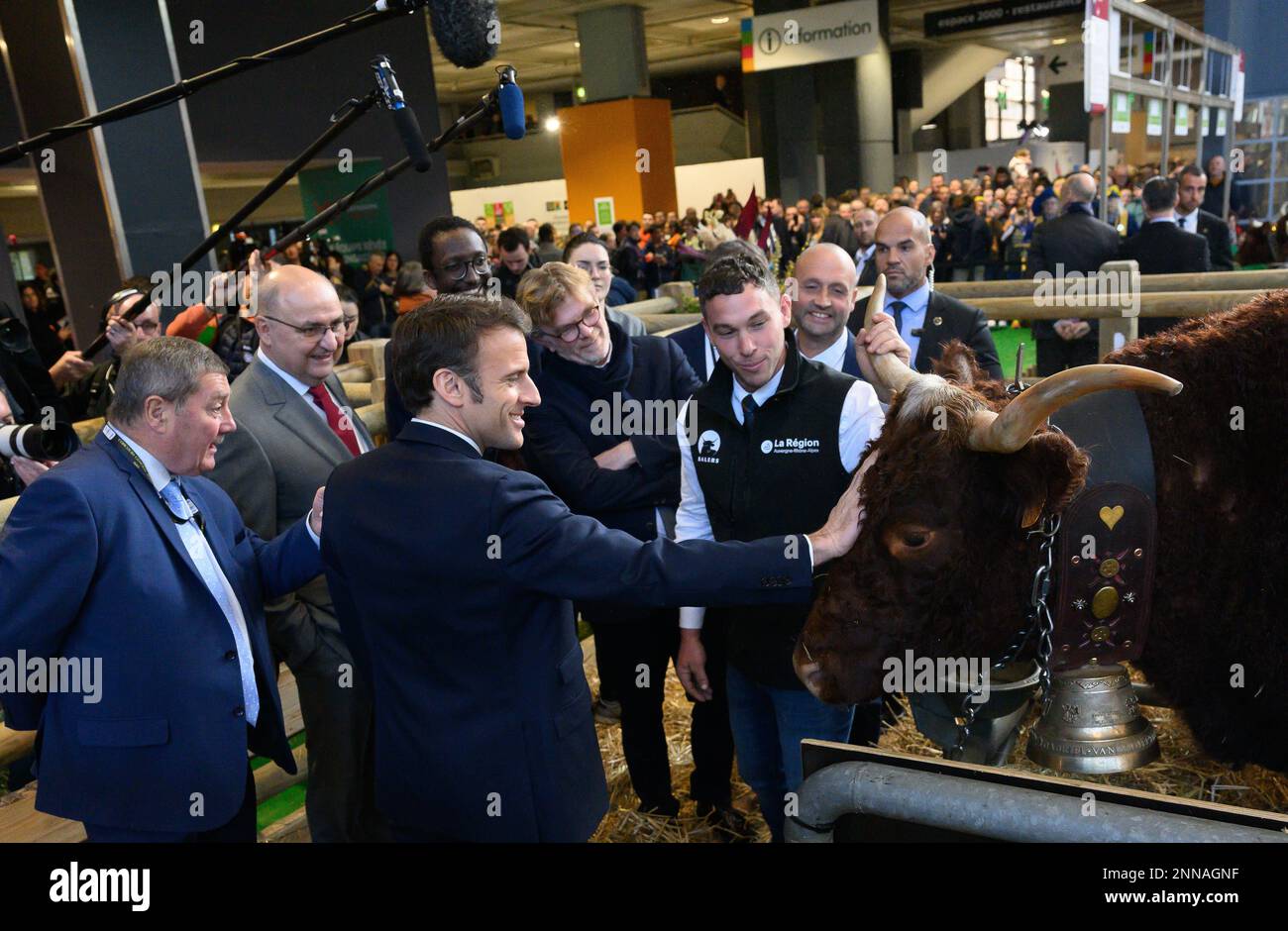 Paris, France. 25th Feb, 2023. Emmanuel Macron strokes the cow Ovalie ...