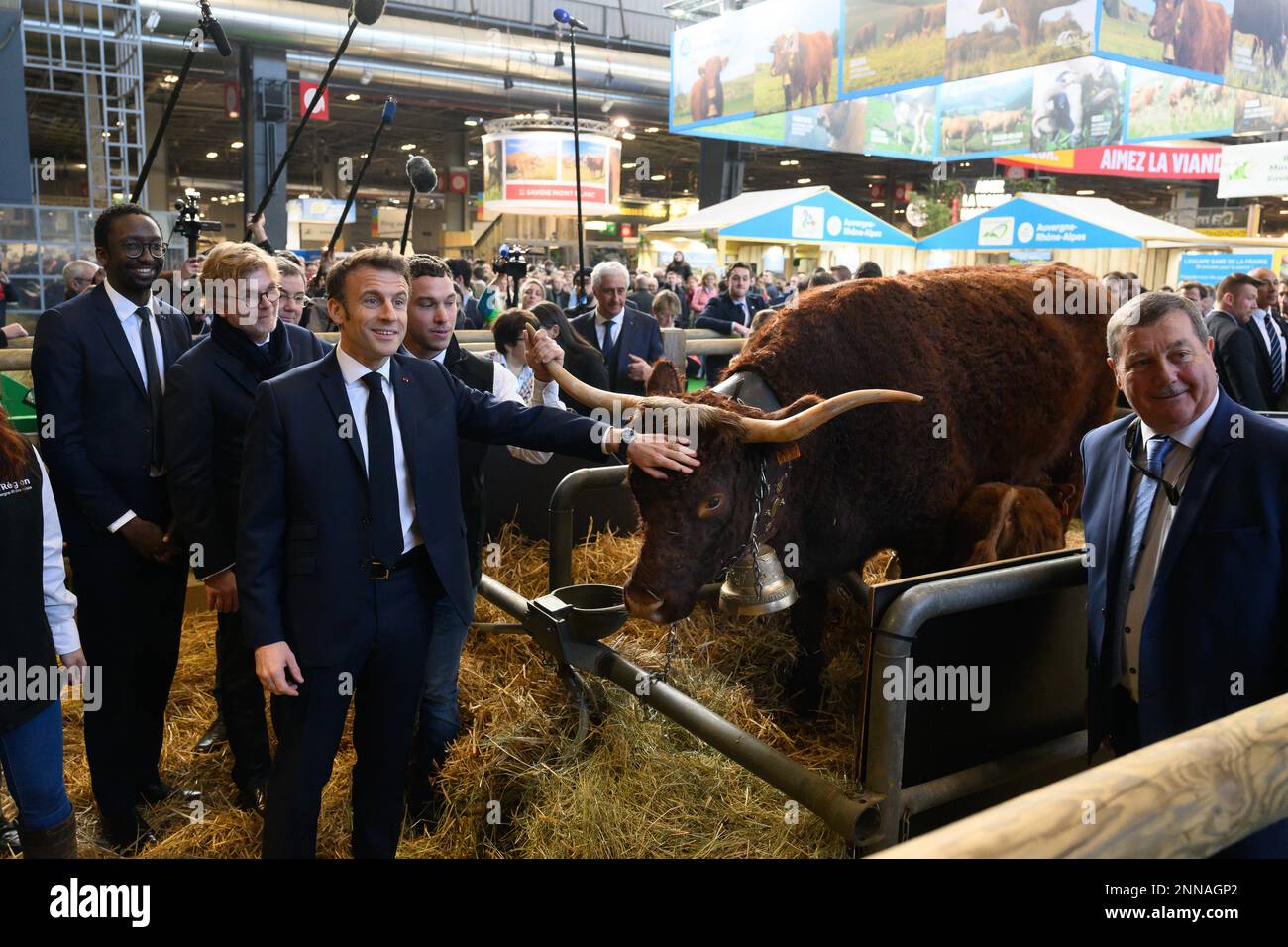 Paris, France. 25th Feb, 2023. Emmanuel Macron looking the cow Ovalie ...