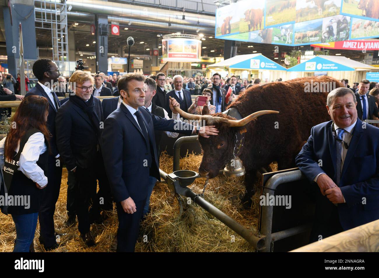 Paris, France. 25th Feb, 2023. Emmanuel Macron strokes the cow Ovalie ...