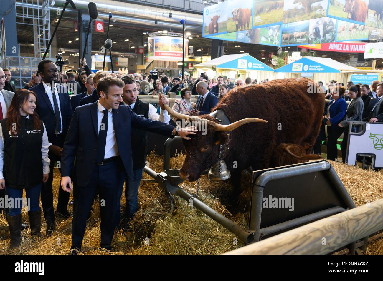 Paris, France. 25th Feb, 2023. Emmanuel Macron strokes the cow Ovalie ...